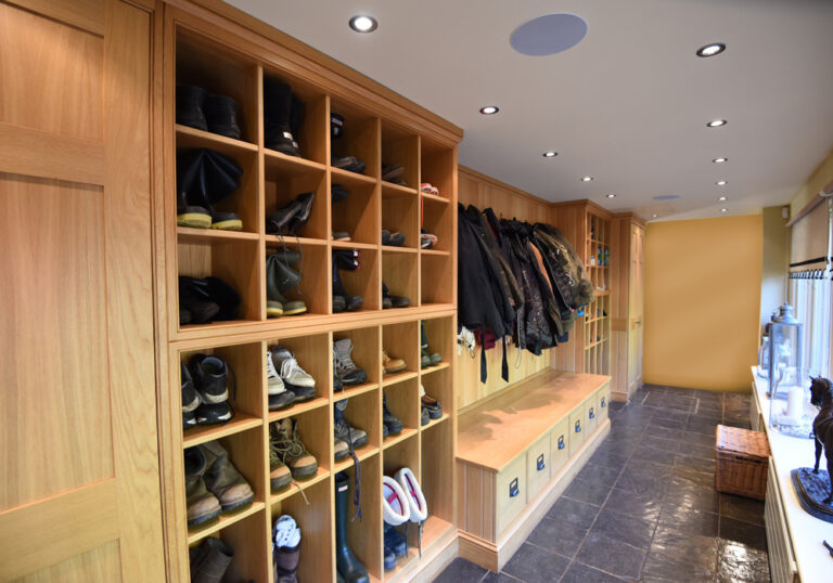 A bespoke boot or utility room with multipurpose fitted storage - Clémaron
